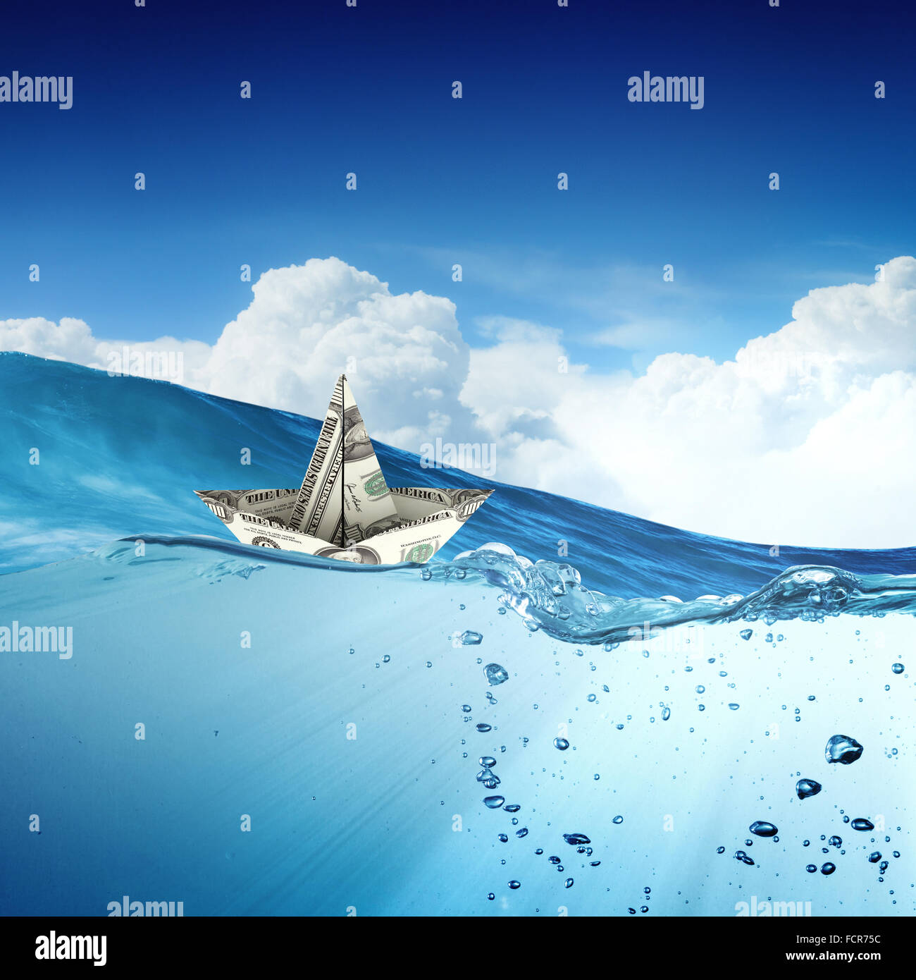 Paper ship floating on water on waves Stock Photo - Alamy