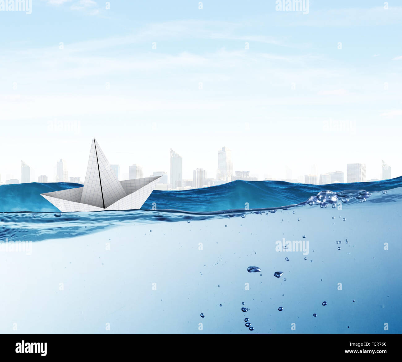 Paper ship floating on water on waves Stock Photo - Alamy