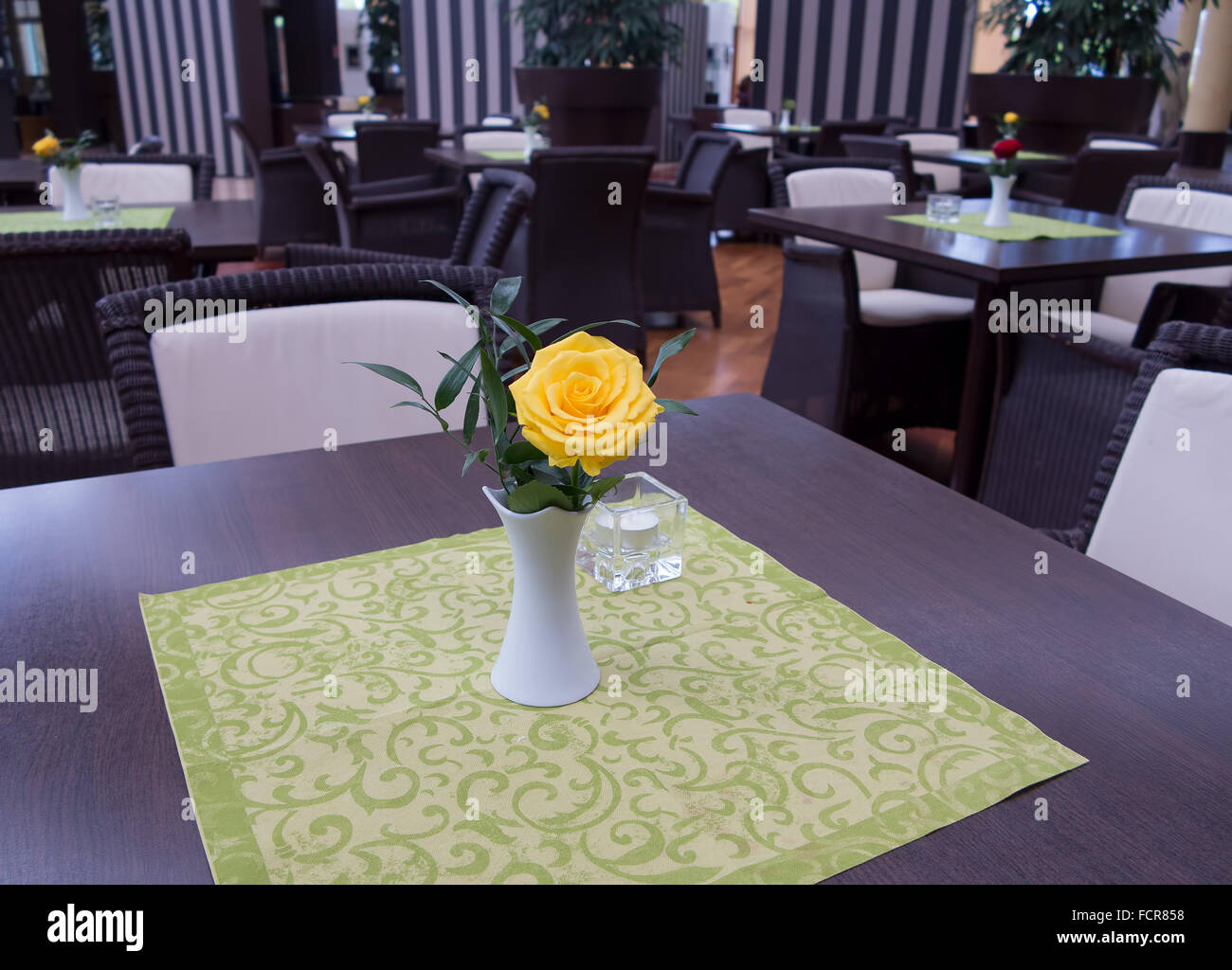 Restaurant table with flower in vase Stock Photo - Alamy