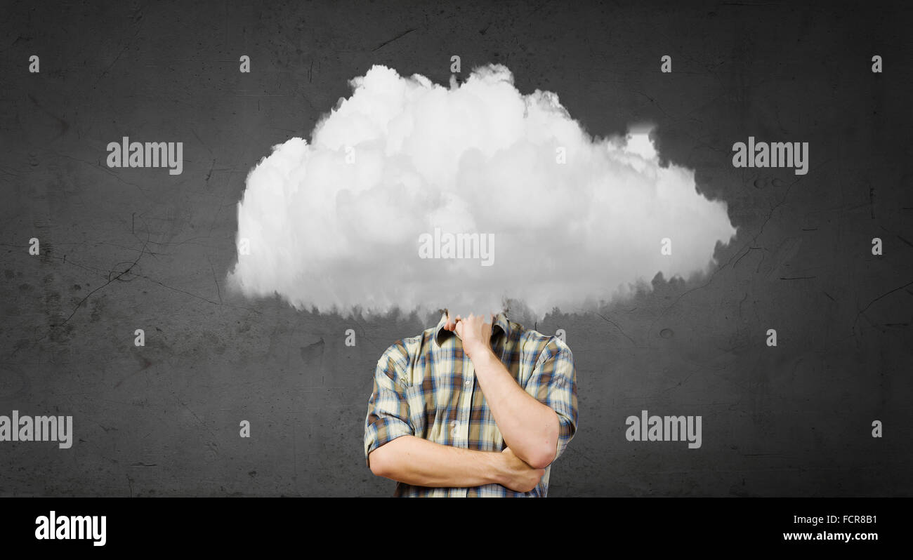 Businessman standing with his head in cloud Stock Photo - Alamy