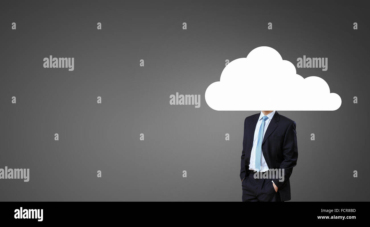 Businessman standing with his head in cloud Stock Photo - Alamy