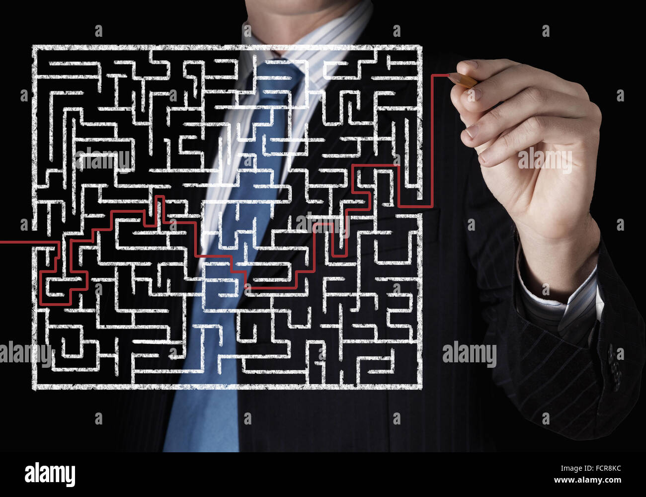 Close up of businessman drawing way out of labyrinth Stock Photo - Alamy