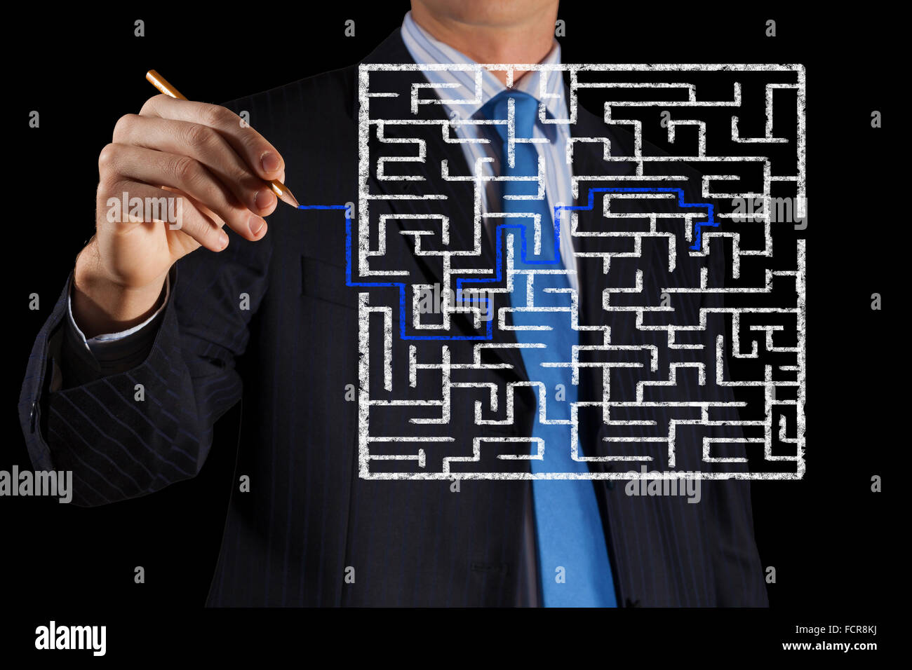 Close up of businessman drawing way out of labyrinth Stock Photo - Alamy