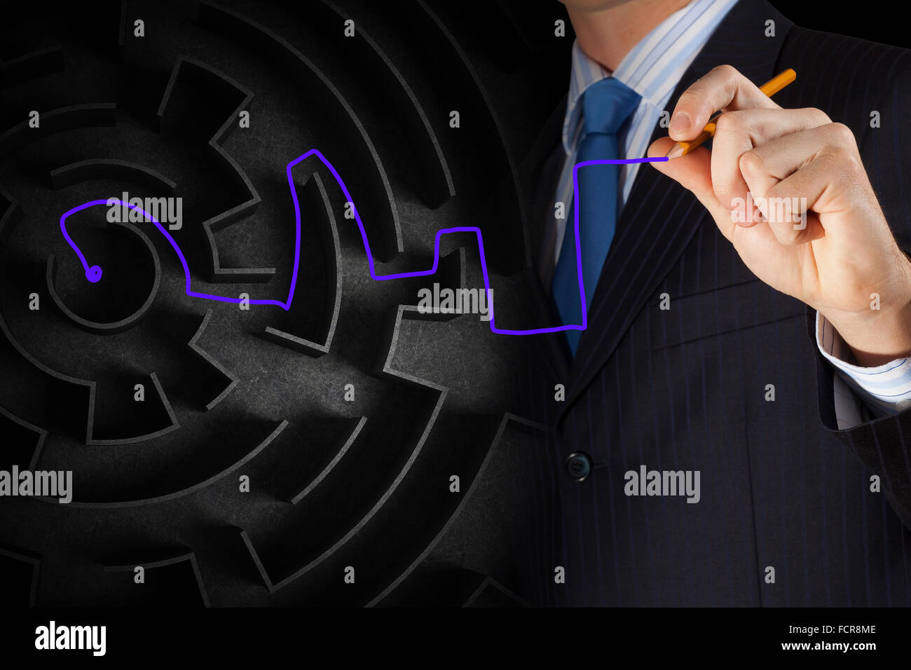 Close up of businessman drawing way out of labyrinth Stock Photo - Alamy