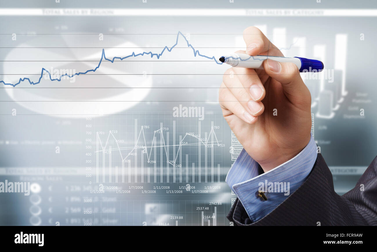 Close up of businessman drawing increasing graph with marker on media ...