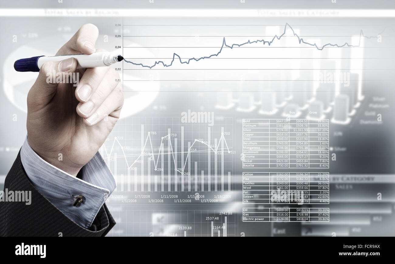 Close up of businessman drawing increasing graph with marker on media ...