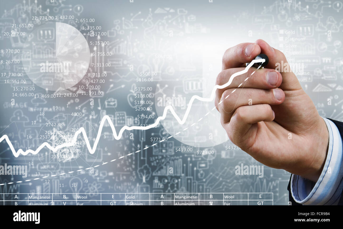 Close up of businessman drawing increasing graph with marker on media ...