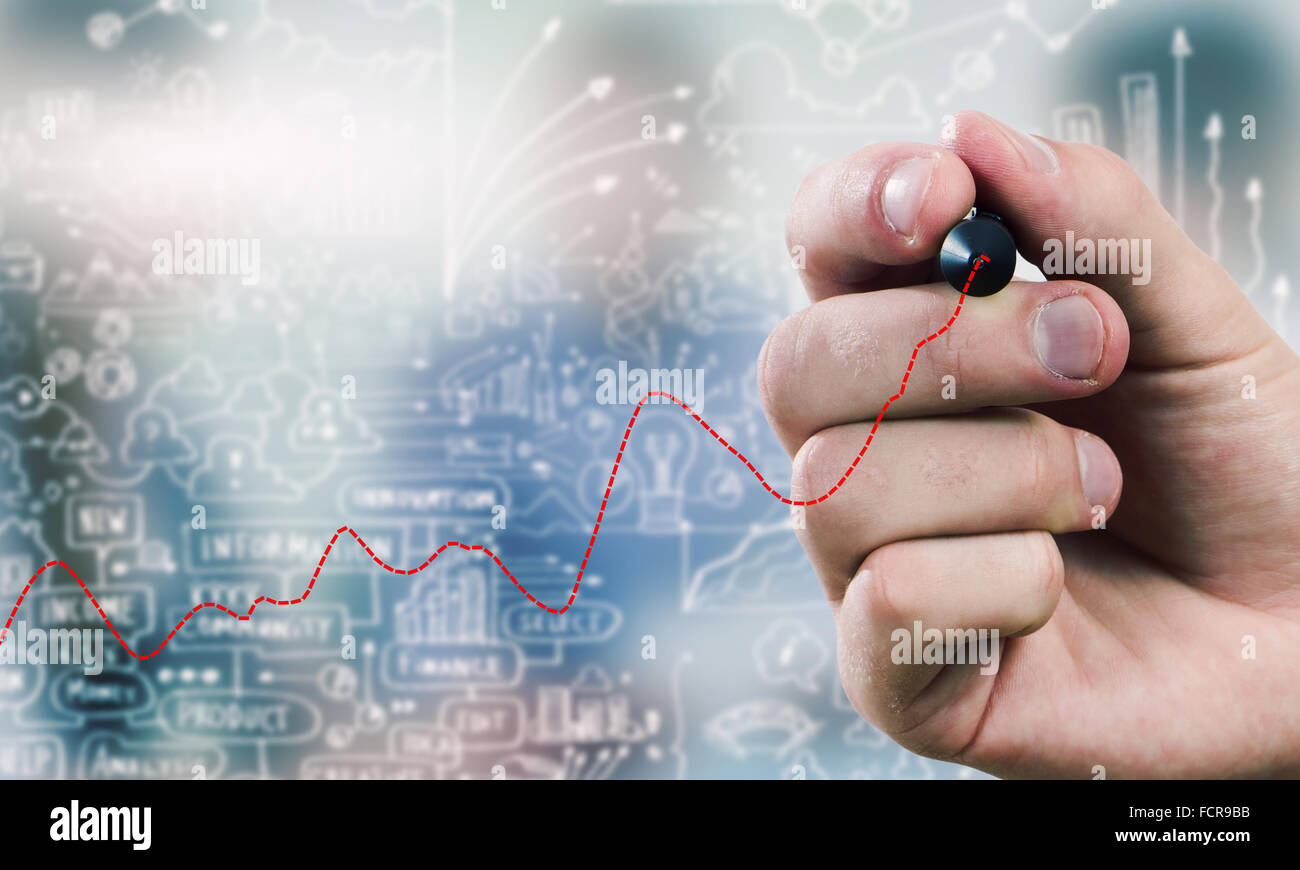 Close up of businessman drawing increasing graph with marker on media ...