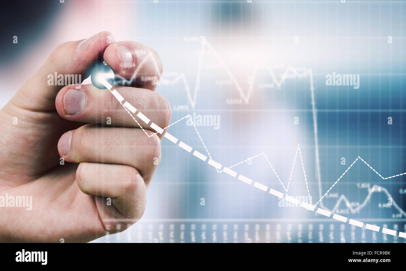 Close up of businessman drawing increasing graph with marker on media ...