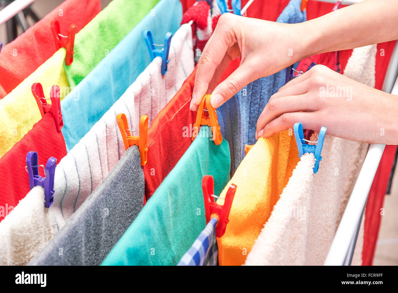 Female hand with clothespin Stock Photo - Alamy