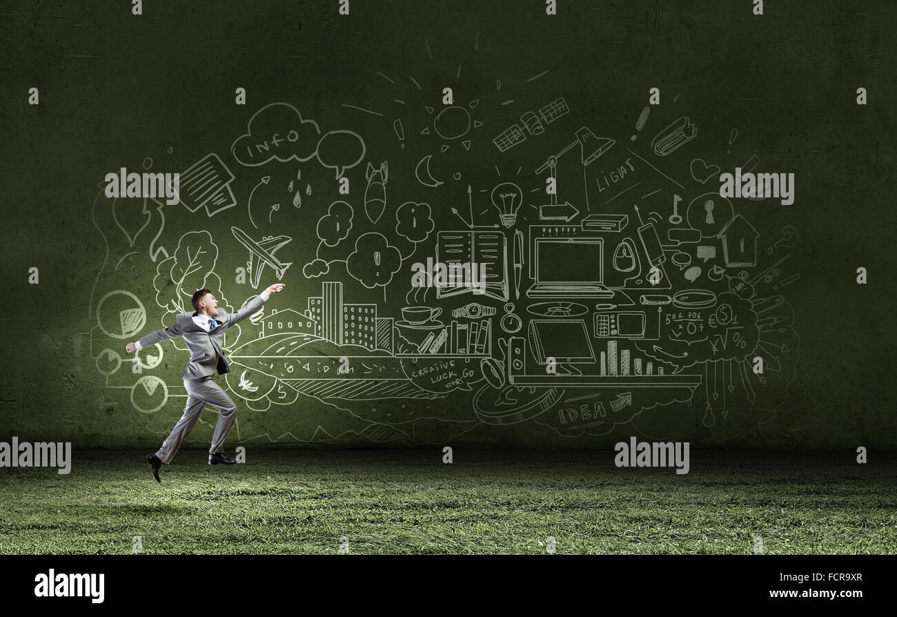 Funny image of running businessman on background of business plan Stock ...