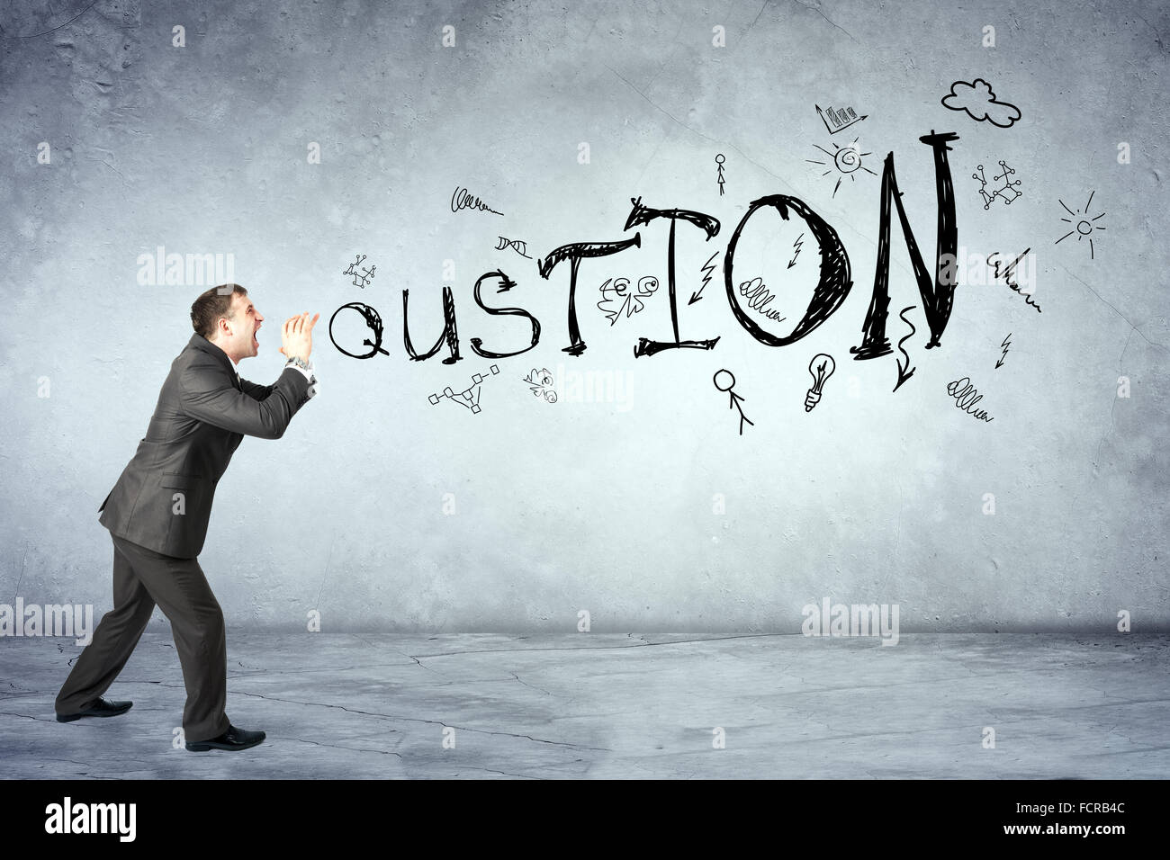 Businessman screaming word question Stock Photo - Alamy