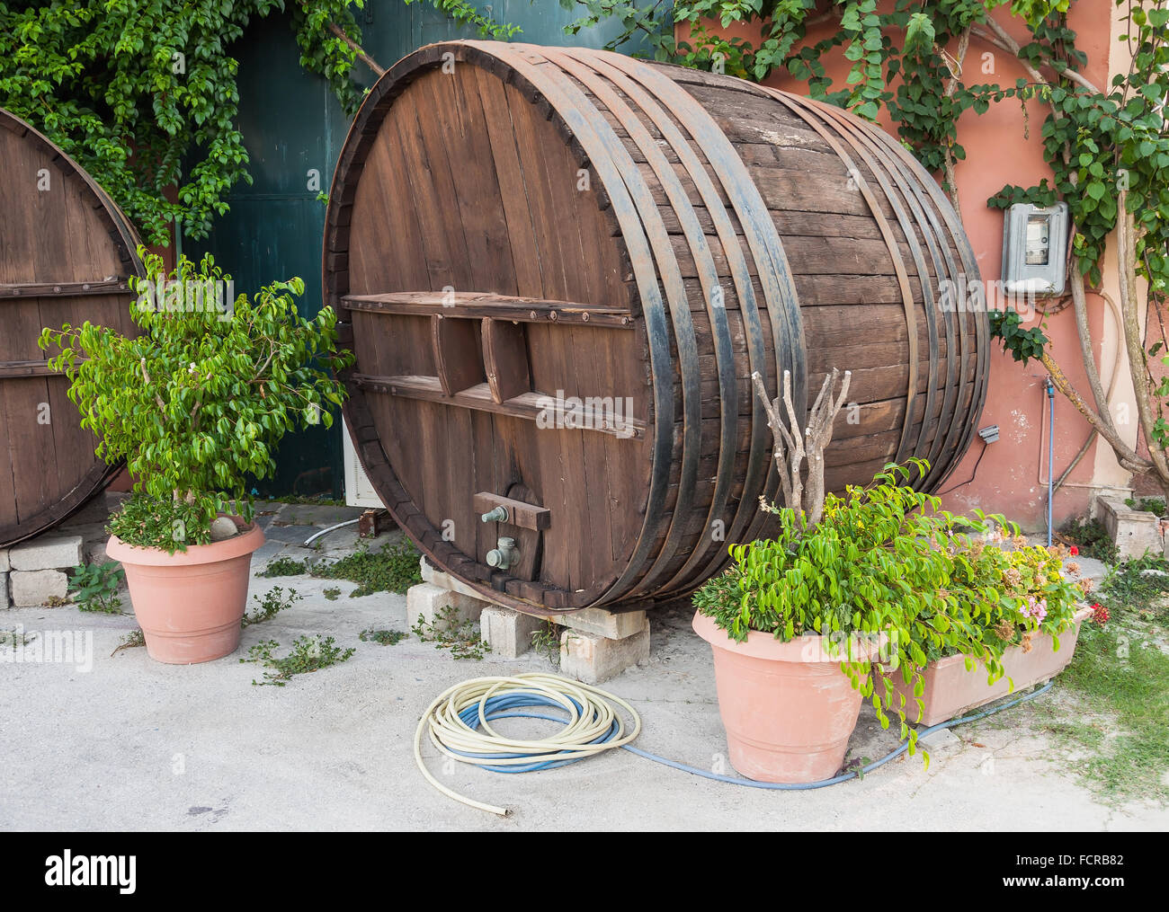 Big wooden wine barrel in a garden Stock Photo - Alamy