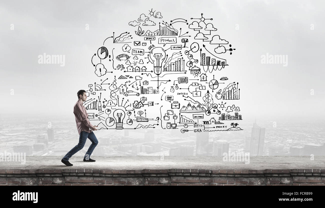 Young man carrying his great business plan in hands Stock Photo - Alamy