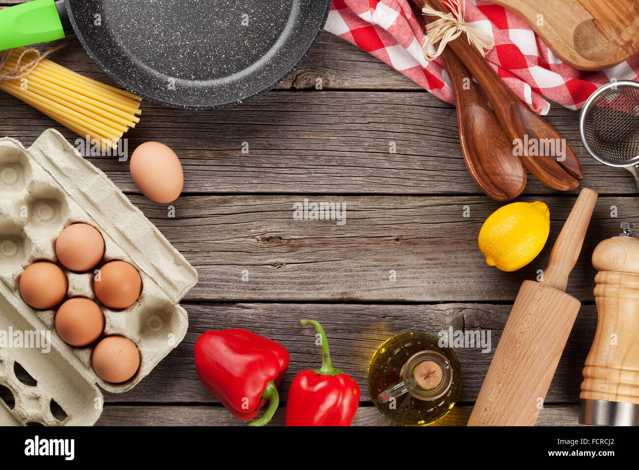 Cooking utensils and ingredients on wooden table. Top view with copy ...