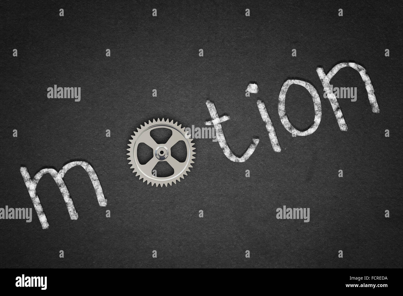 Word motion with gear instead of letter O Stock Photo - Alamy