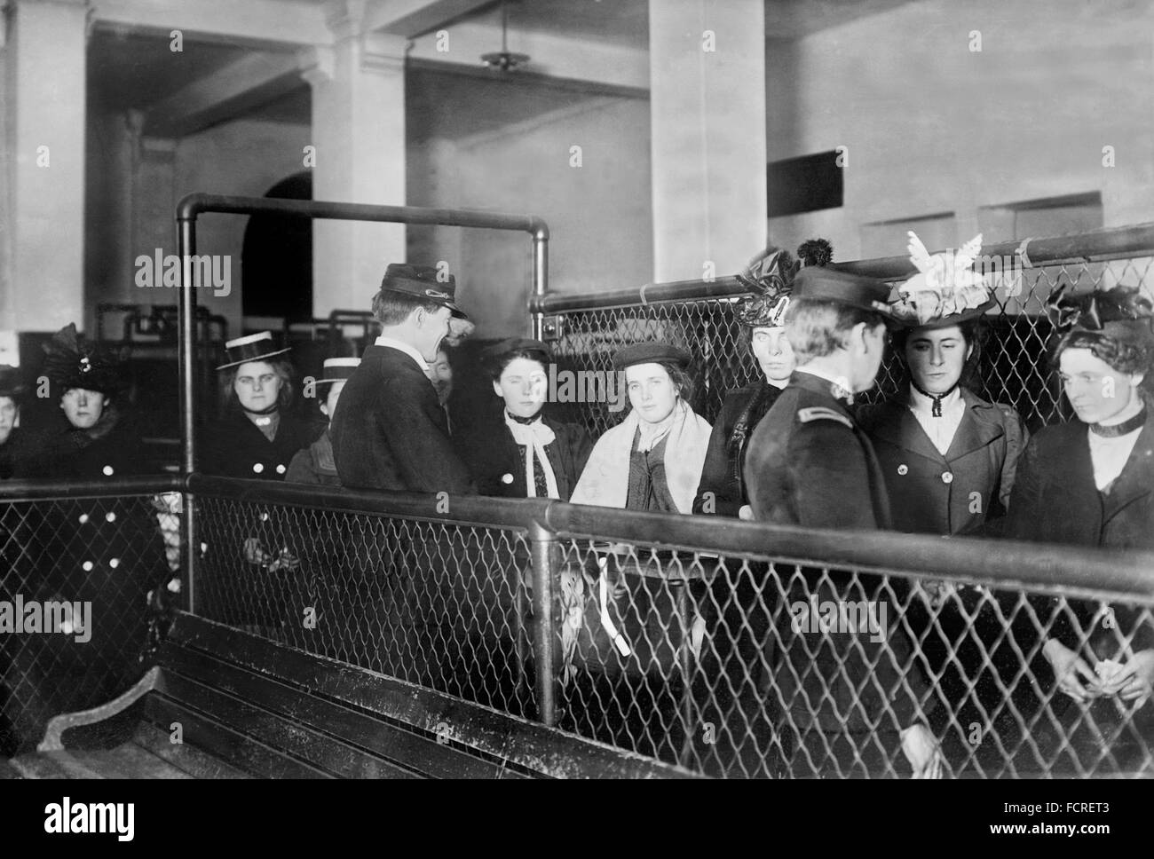 Immigrants at Ellis Island, New York, NY, early 20th century Stock ...