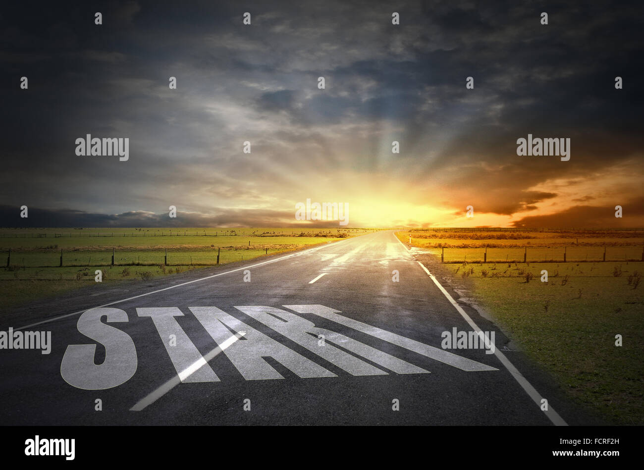 Start word on asphalt road and sunrise at horison line Stock Photo - Alamy