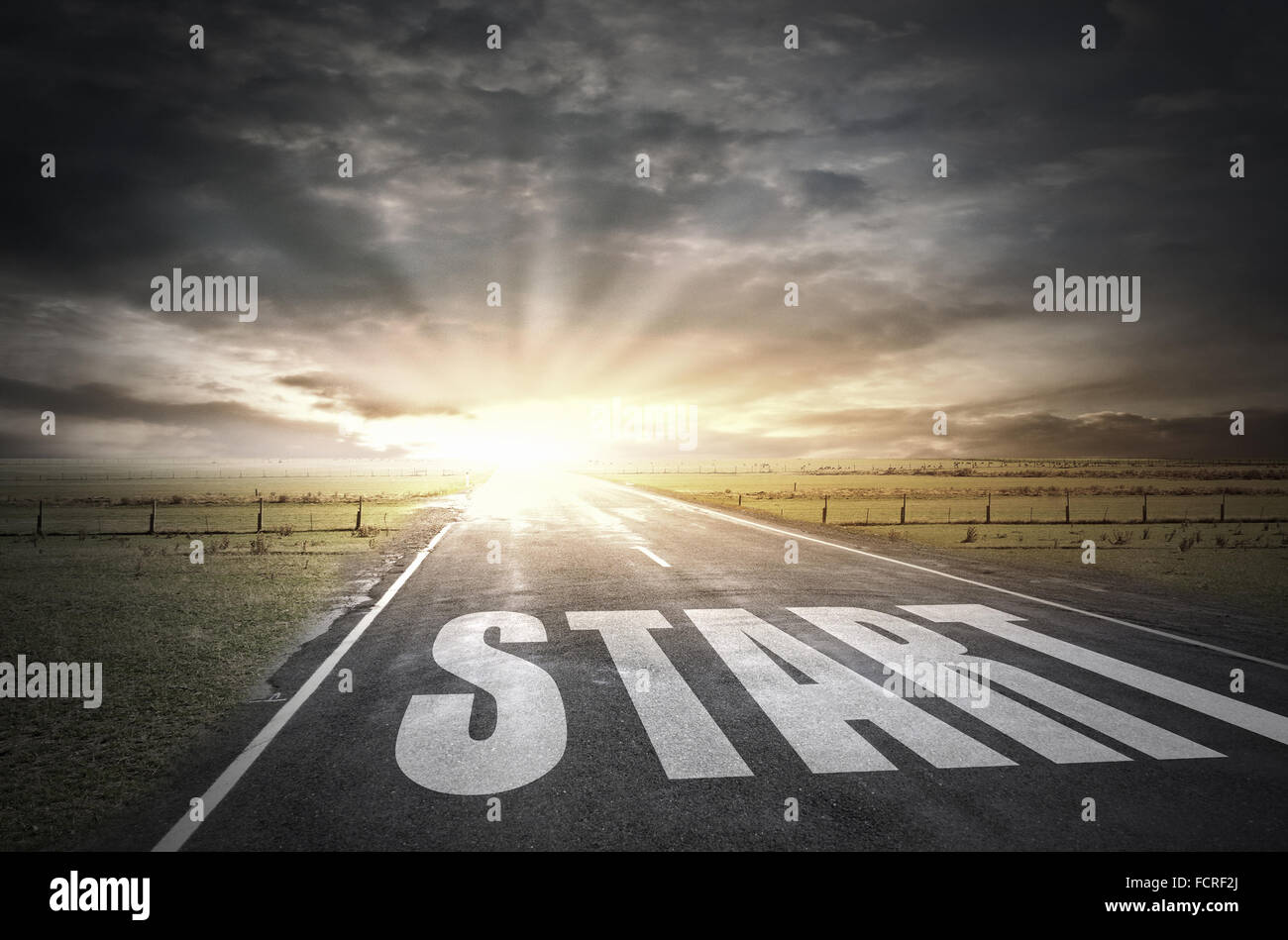Start word on asphalt road and sunrise at horison line Stock Photo - Alamy