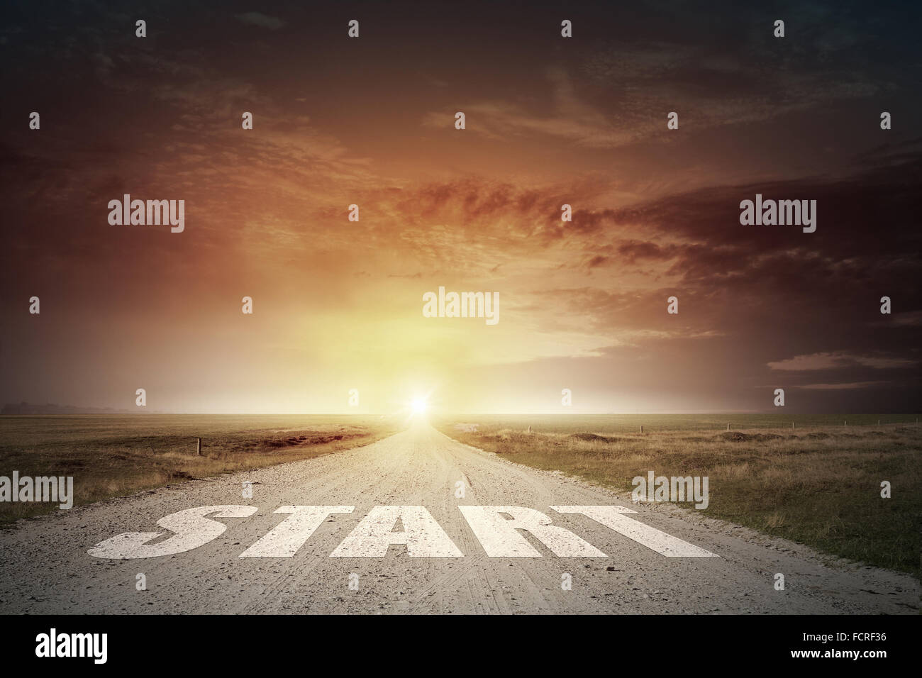 Start word on asphalt road and sunrise at horison line Stock Photo - Alamy