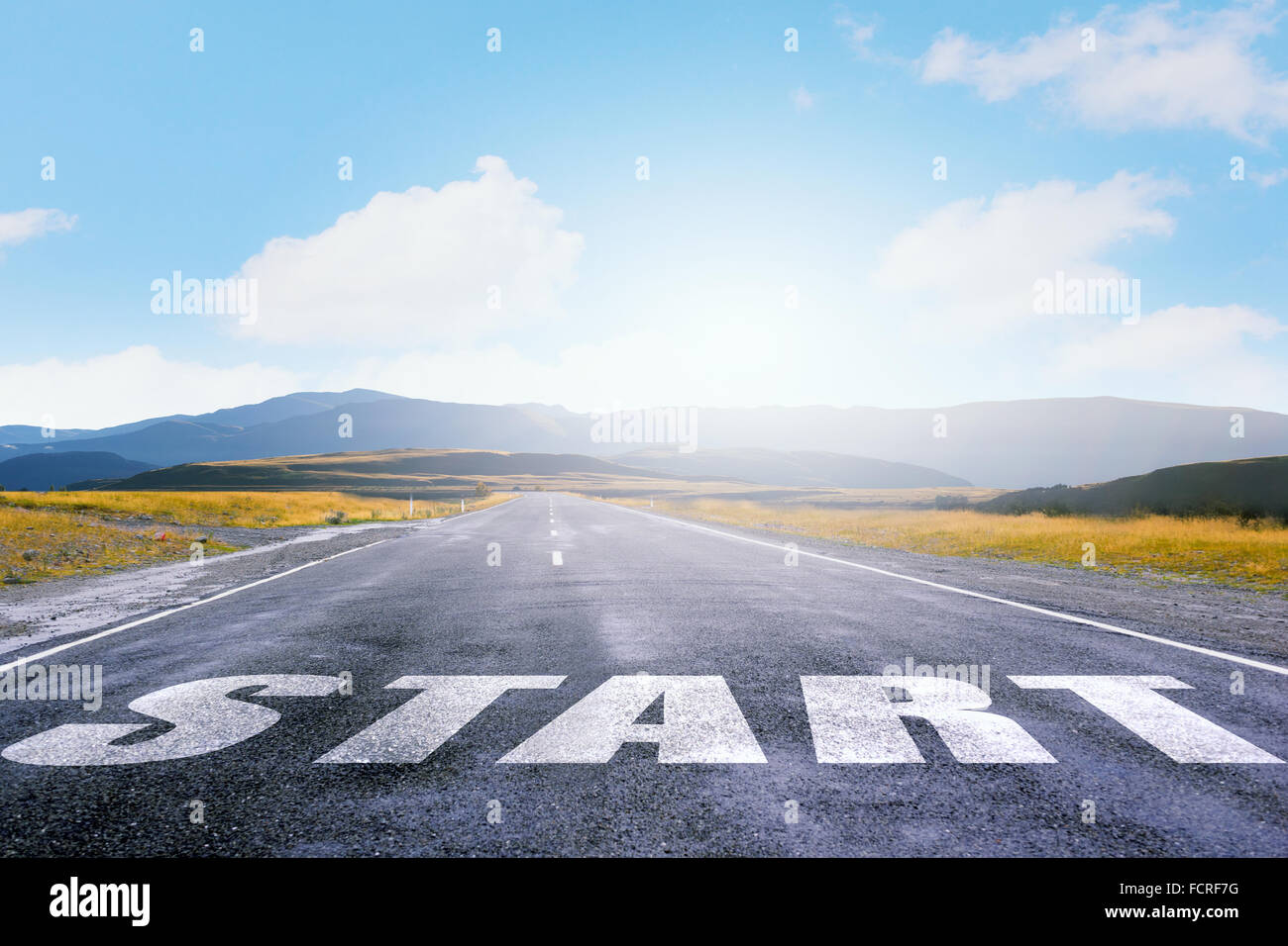 Start word as motivation writen on asphalt road Stock Photo - Alamy