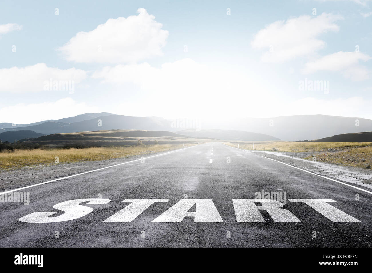 Start word as motivation writen on asphalt road Stock Photo - Alamy