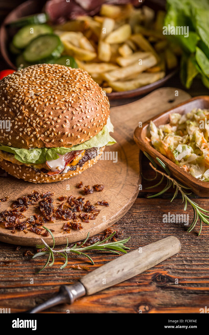 Burger in sesame bun with succulent beef patties Stock Photo - Alamy