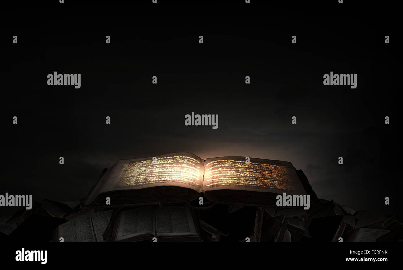 Old black magic book lights hi-res stock photography and images - Alamy