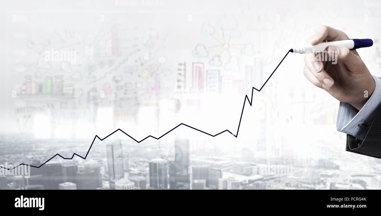 Hand of businessman drawing with pencil increasing graph Stock Photo ...