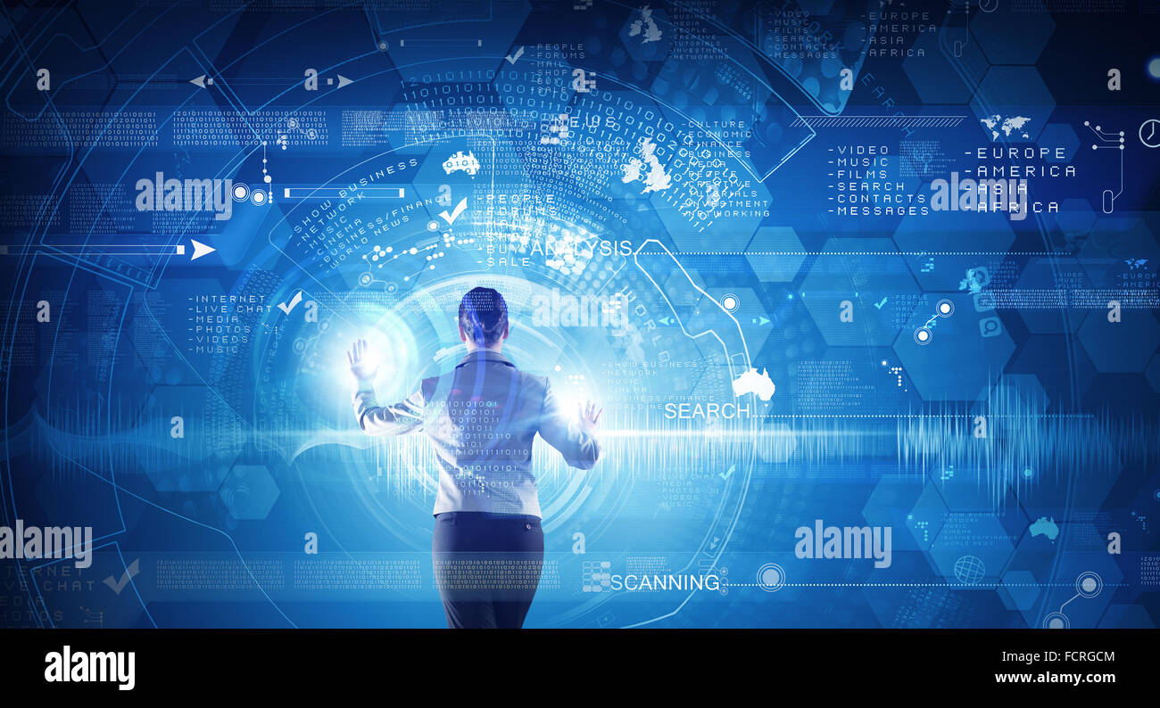 Back view of businesswoman working with modern virtual technologies ...