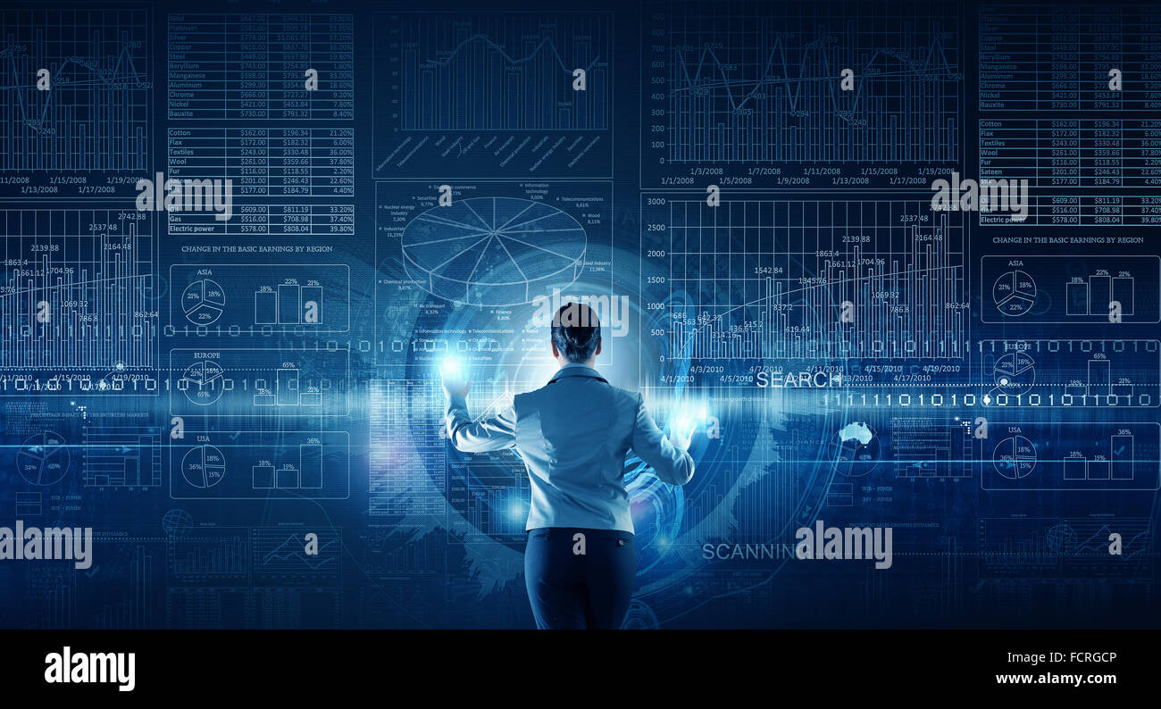 Back view of businesswoman working with modern virtual technologies ...