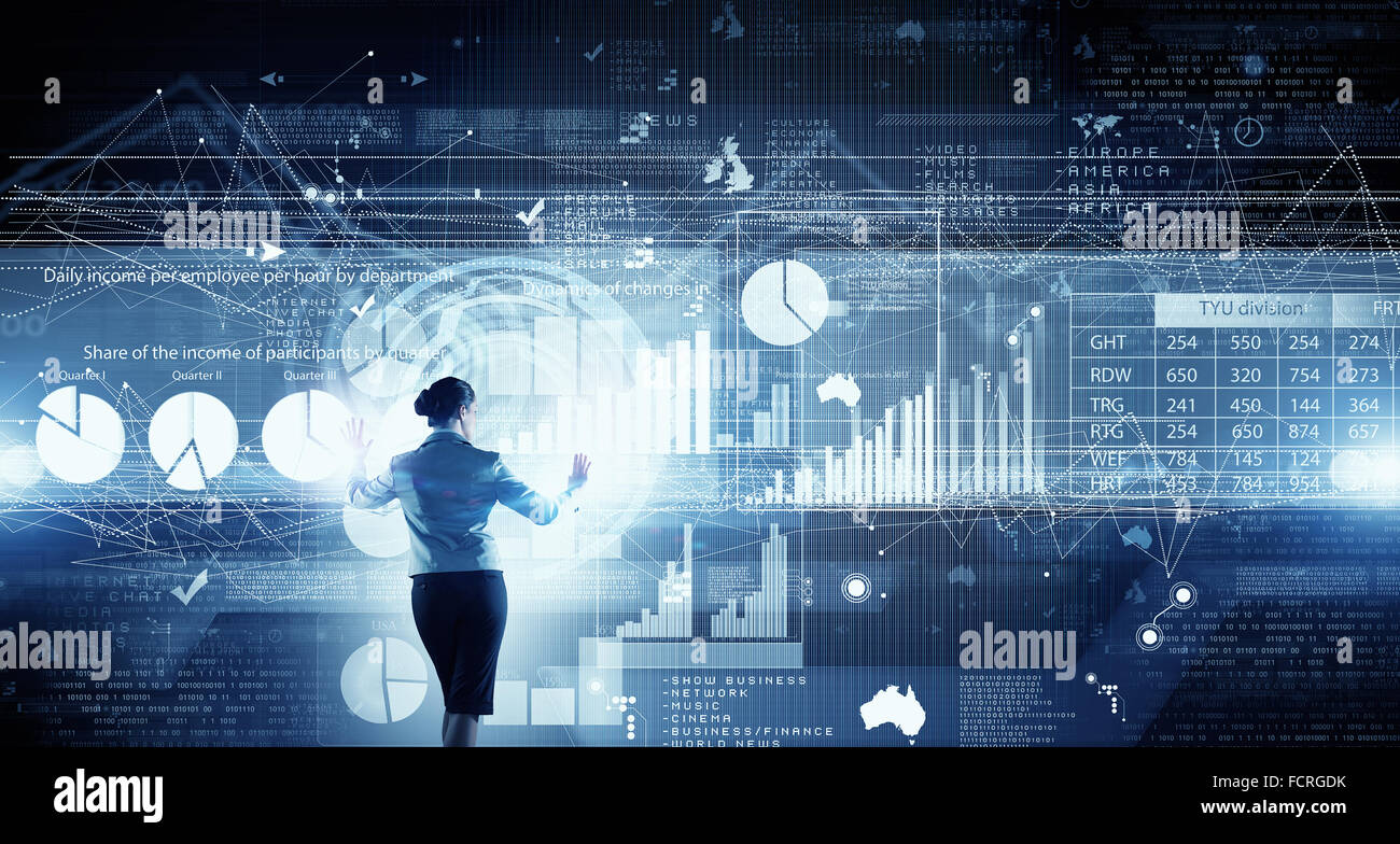 Back view of businesswoman working with modern virtual technologies ...