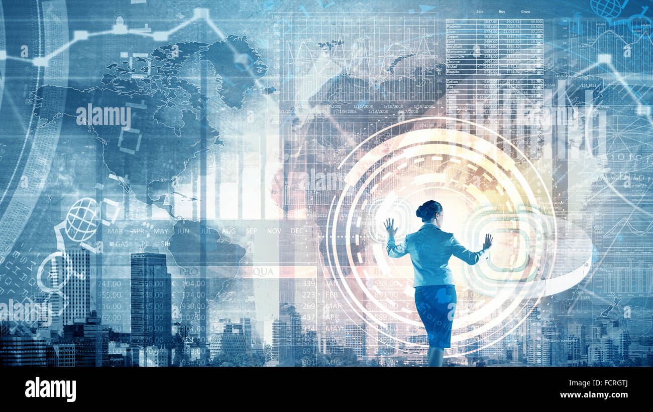 Back view of businesswoman working with modern virtual technologies ...