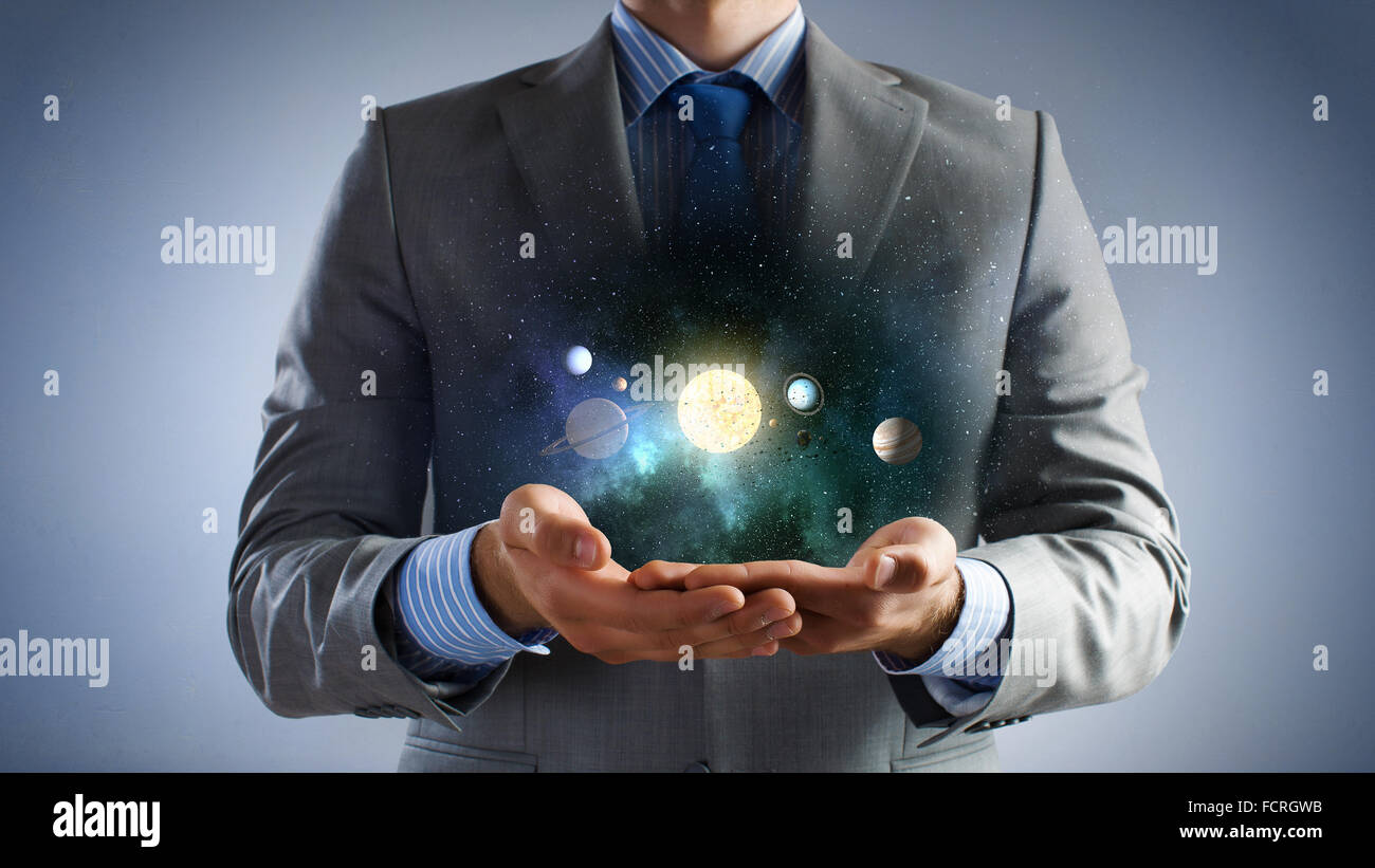 Close up of human hand with planet of sun system Stock Photo - Alamy