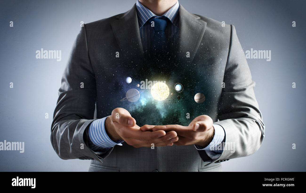 Close up of human hand with planet of sun system Stock Photo - Alamy