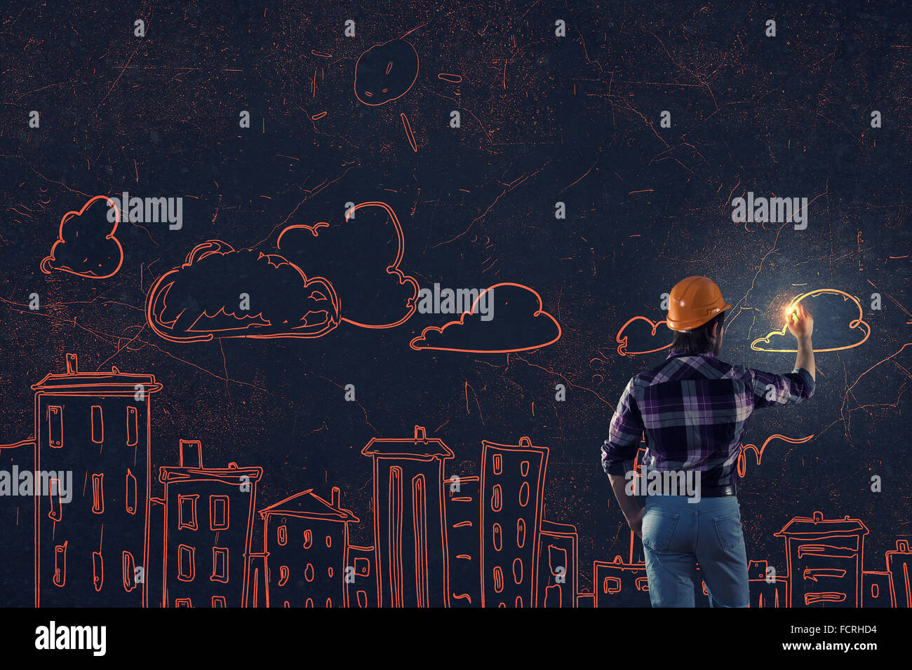 Back view of businessman drawing sketches of construction project on ...