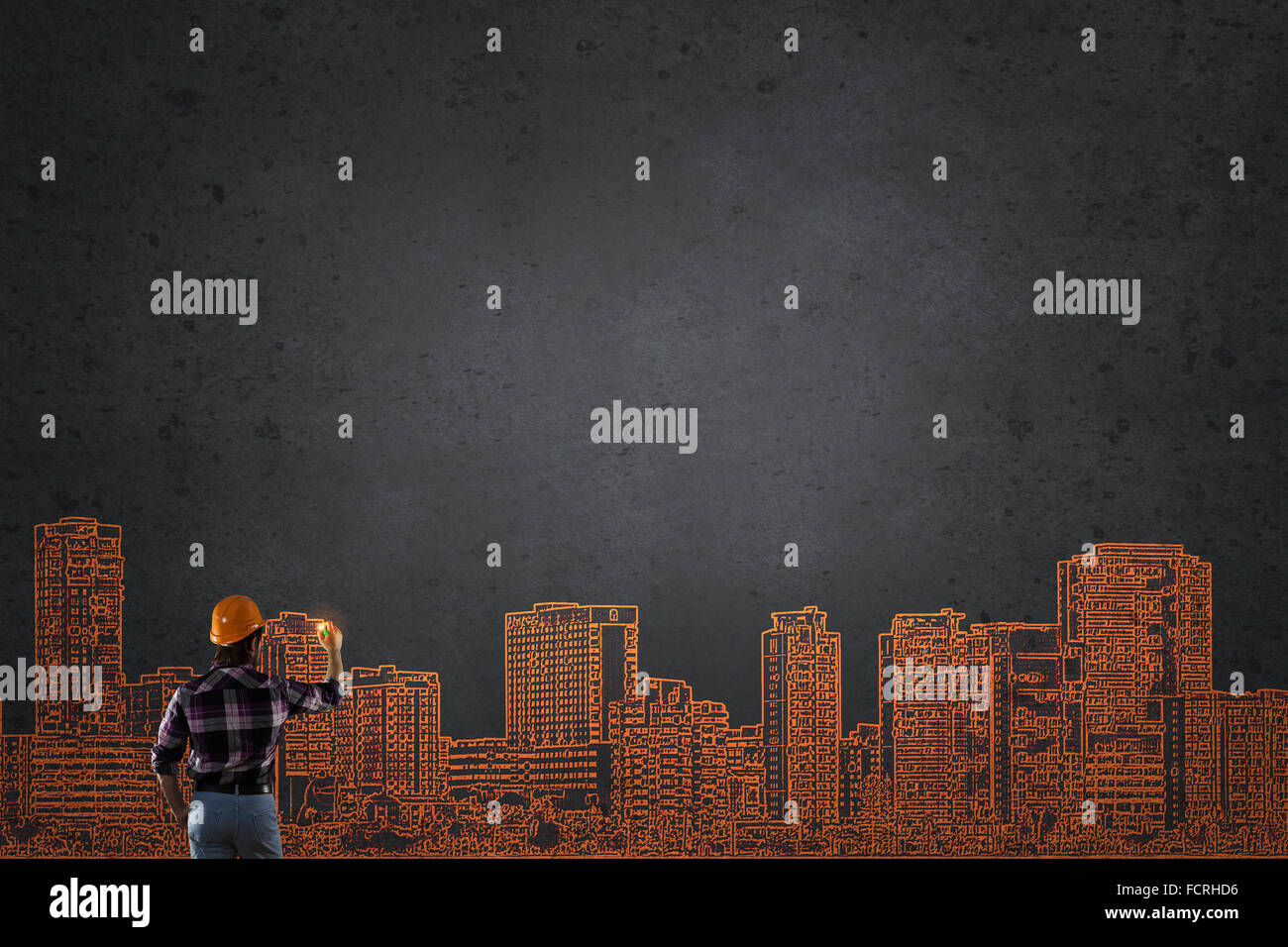 Back view of businessman drawing sketches of construction project on ...