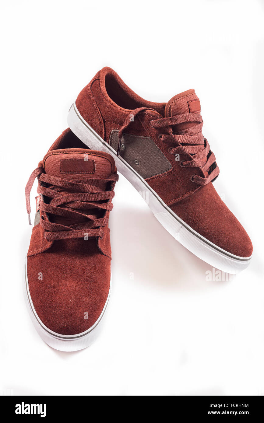 Red skater sneakers isolated on white background Stock Photo - Alamy