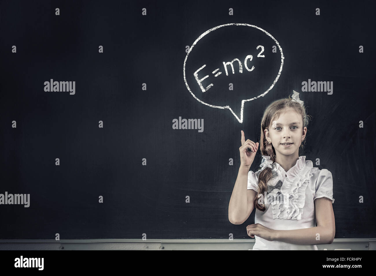 School girl pointing at science formula with finger Stock Photo - Alamy
