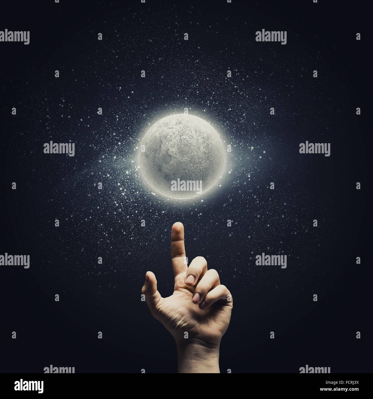 Man's hand pointing at moon with finger Stock Photo - Alamy