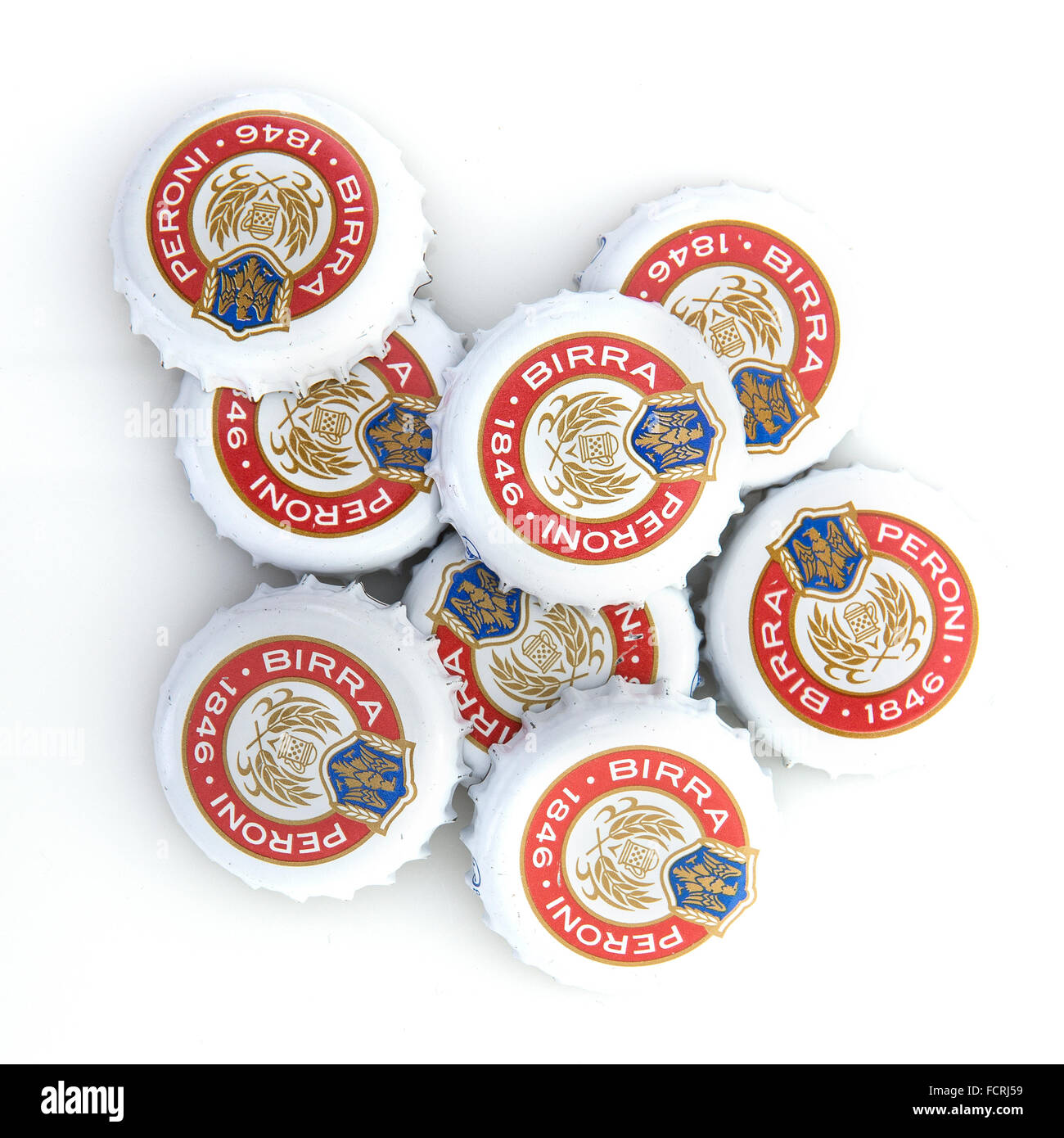 Peroni beer bottle caps on white background Stock Photo - Alamy