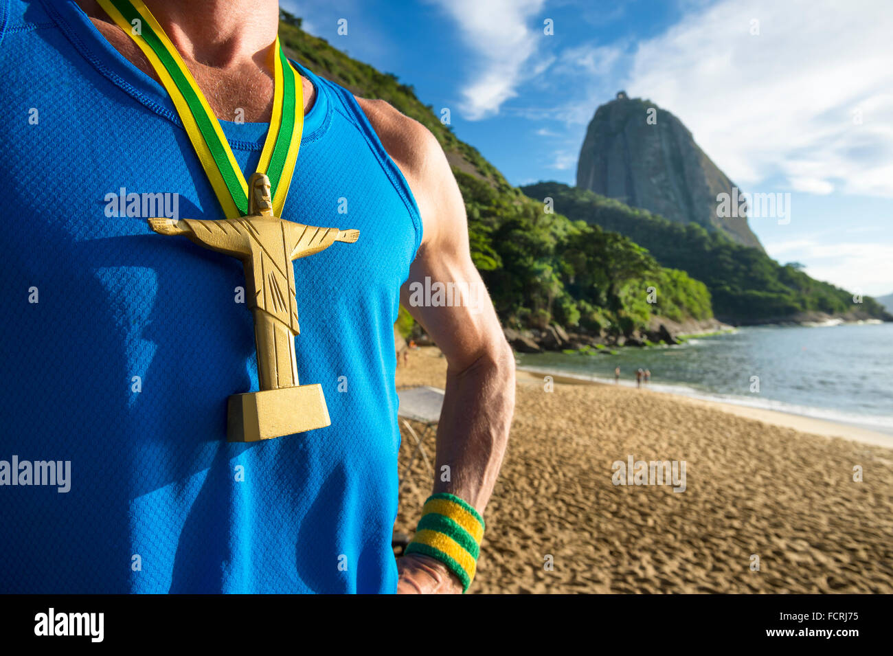 Brazilian athlete standing with religious gold medal in the form of a ...