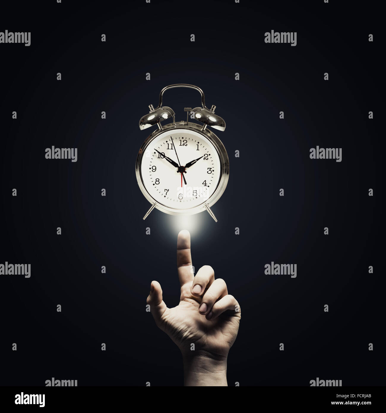 Close up of man hand pointing at clock watch symbol Stock Photo - Alamy
