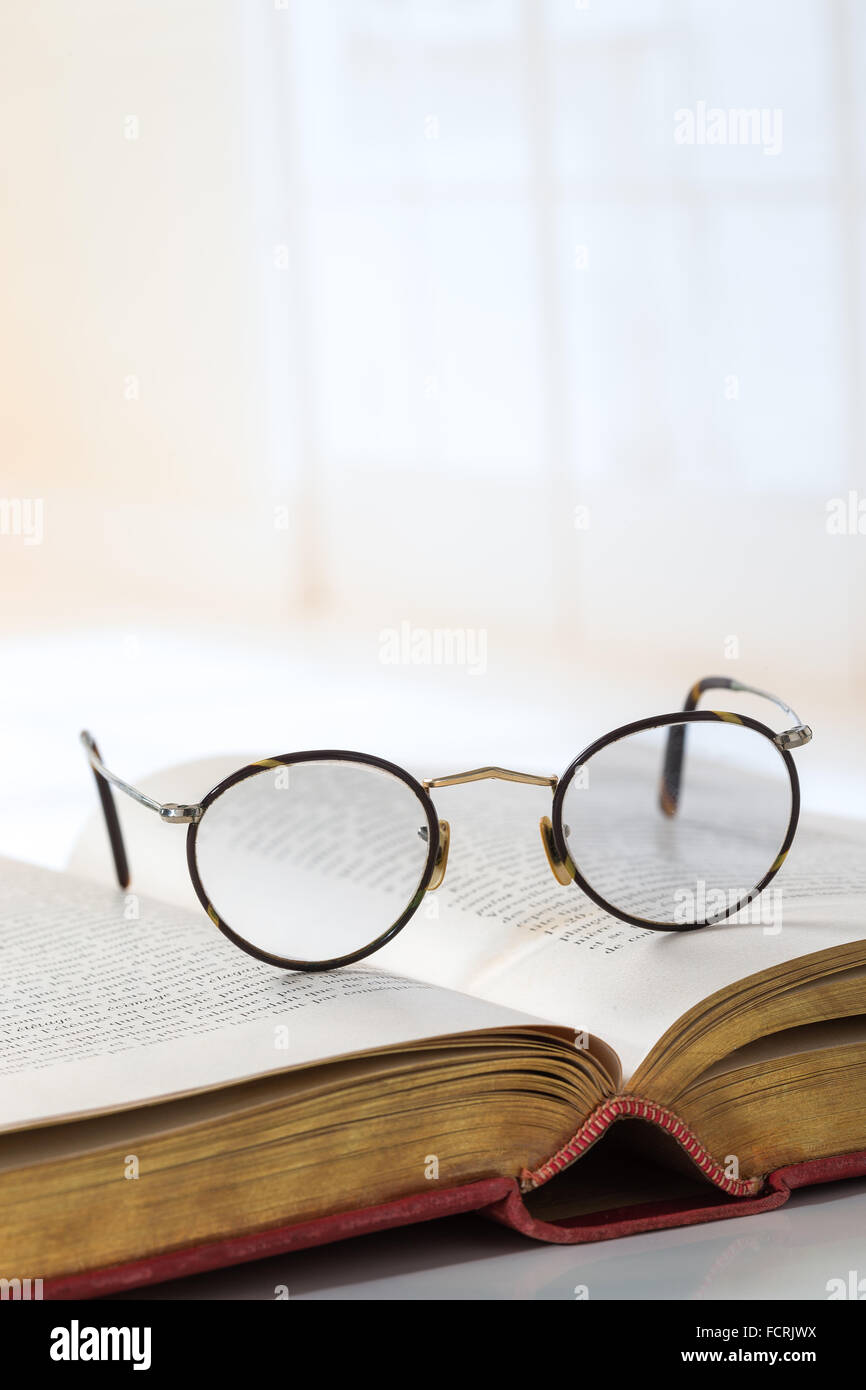 Old books with eye glasses isolated on white background Stock Photo - Alamy
