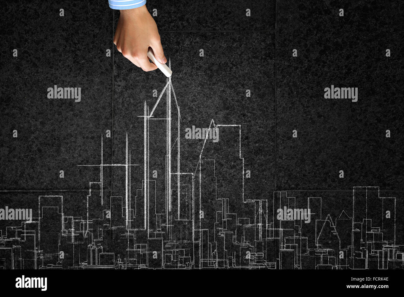 Close up of hand drawing urban city building on chalk board Stock Photo ...
