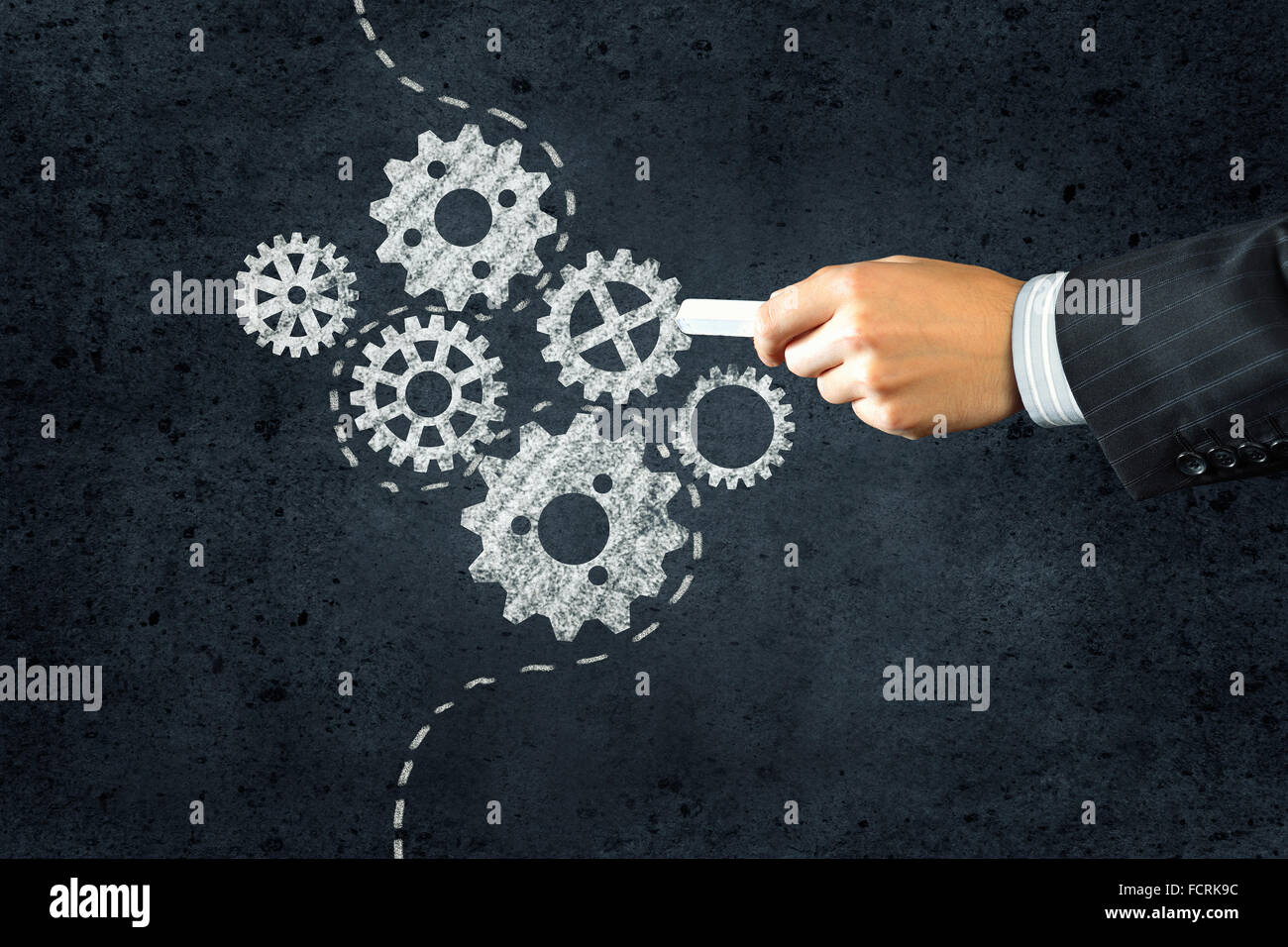 Close up of hand drawing gears mechanism with chalk Stock Photo - Alamy