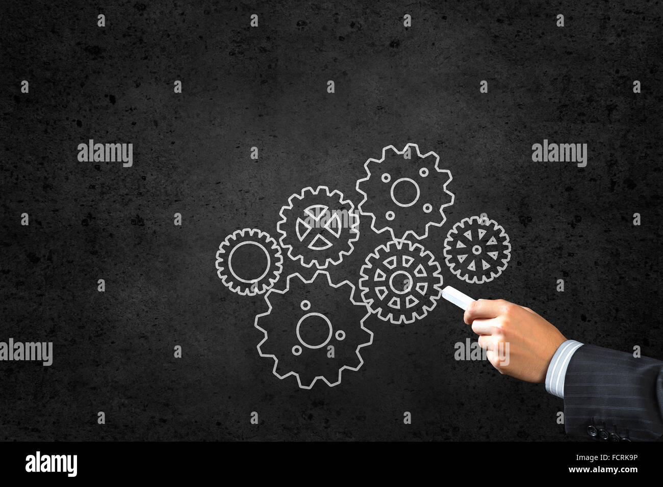 Close up of hand drawing gears mechanism with chalk Stock Photo - Alamy