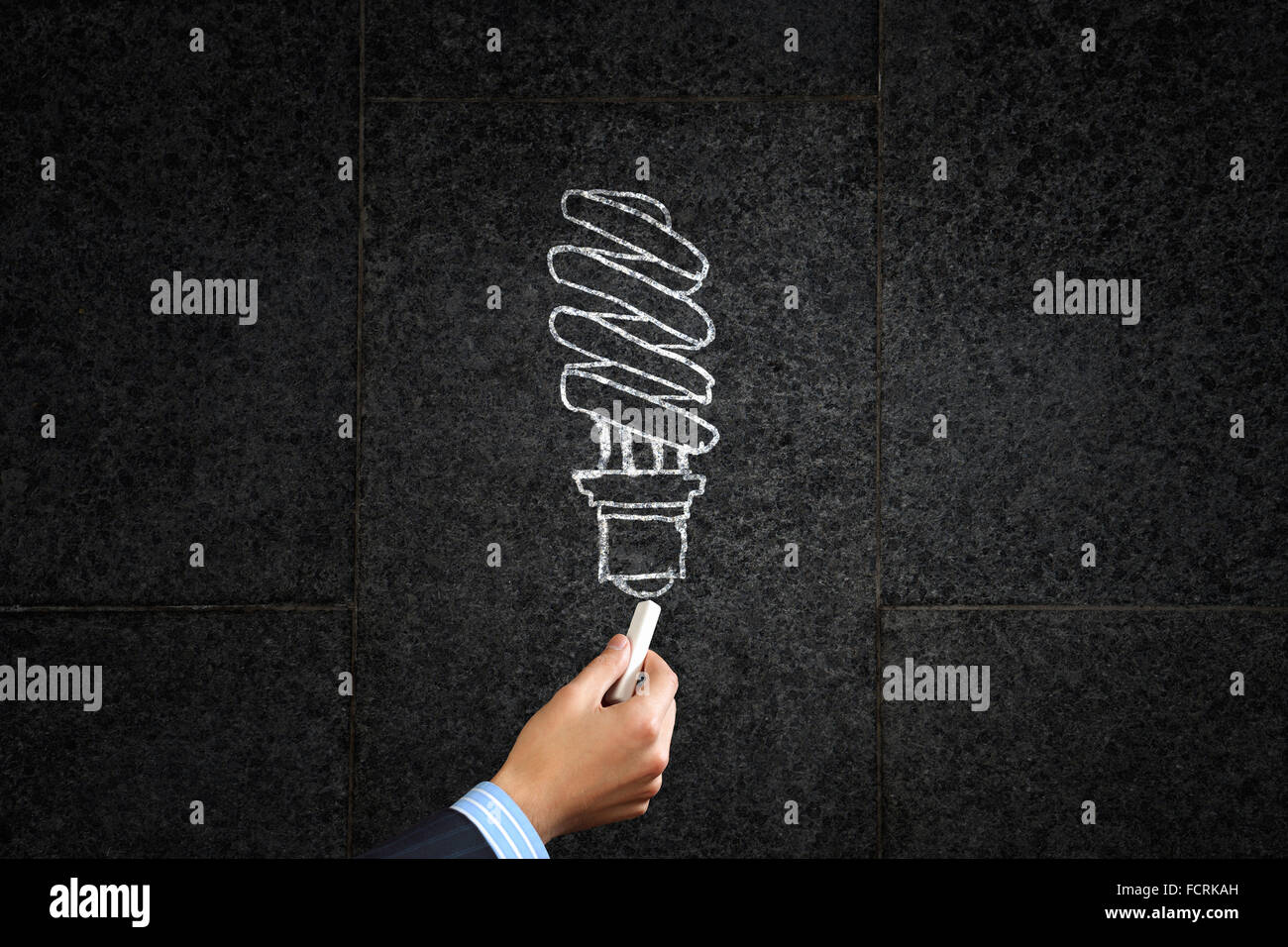Close up of hand drawing light bulb with chalk Stock Photo - Alamy
