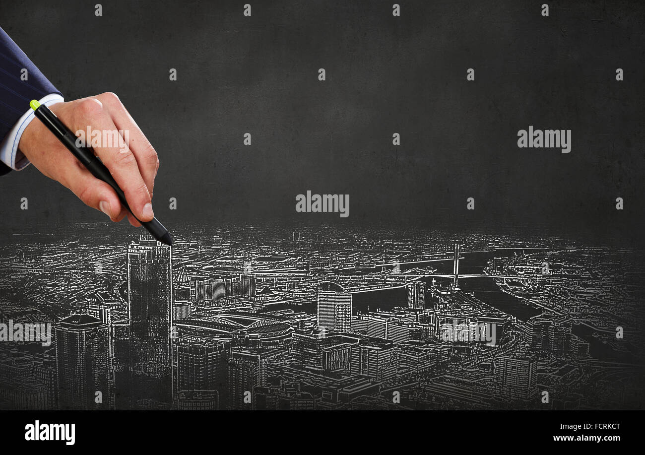 Close up of hand drawing urban buildings with marker Stock Photo - Alamy