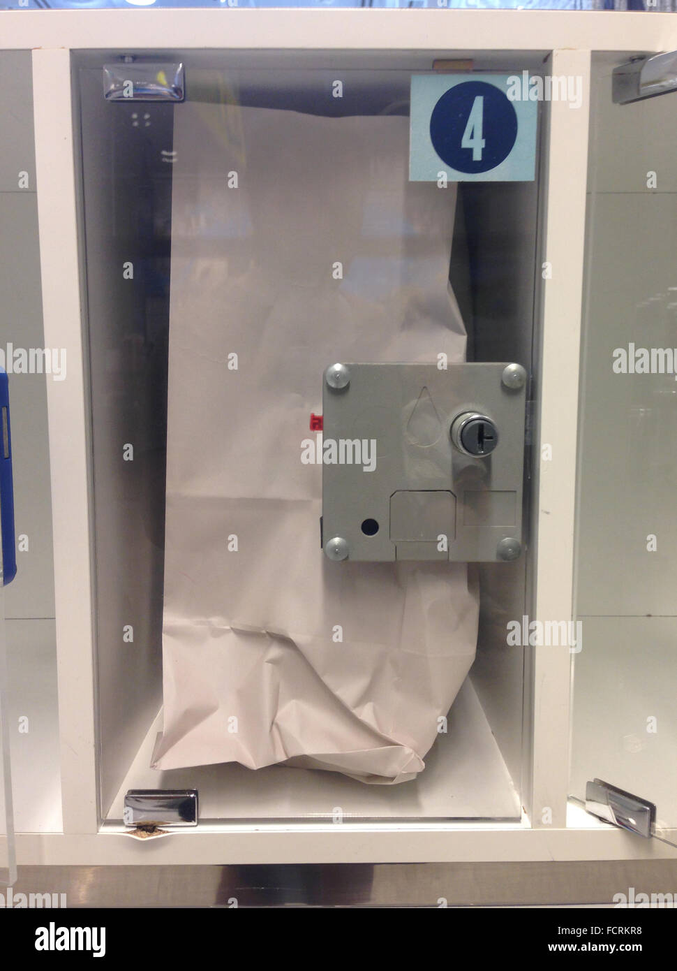 Fashion store locker with paper bag inside Stock Photo - Alamy